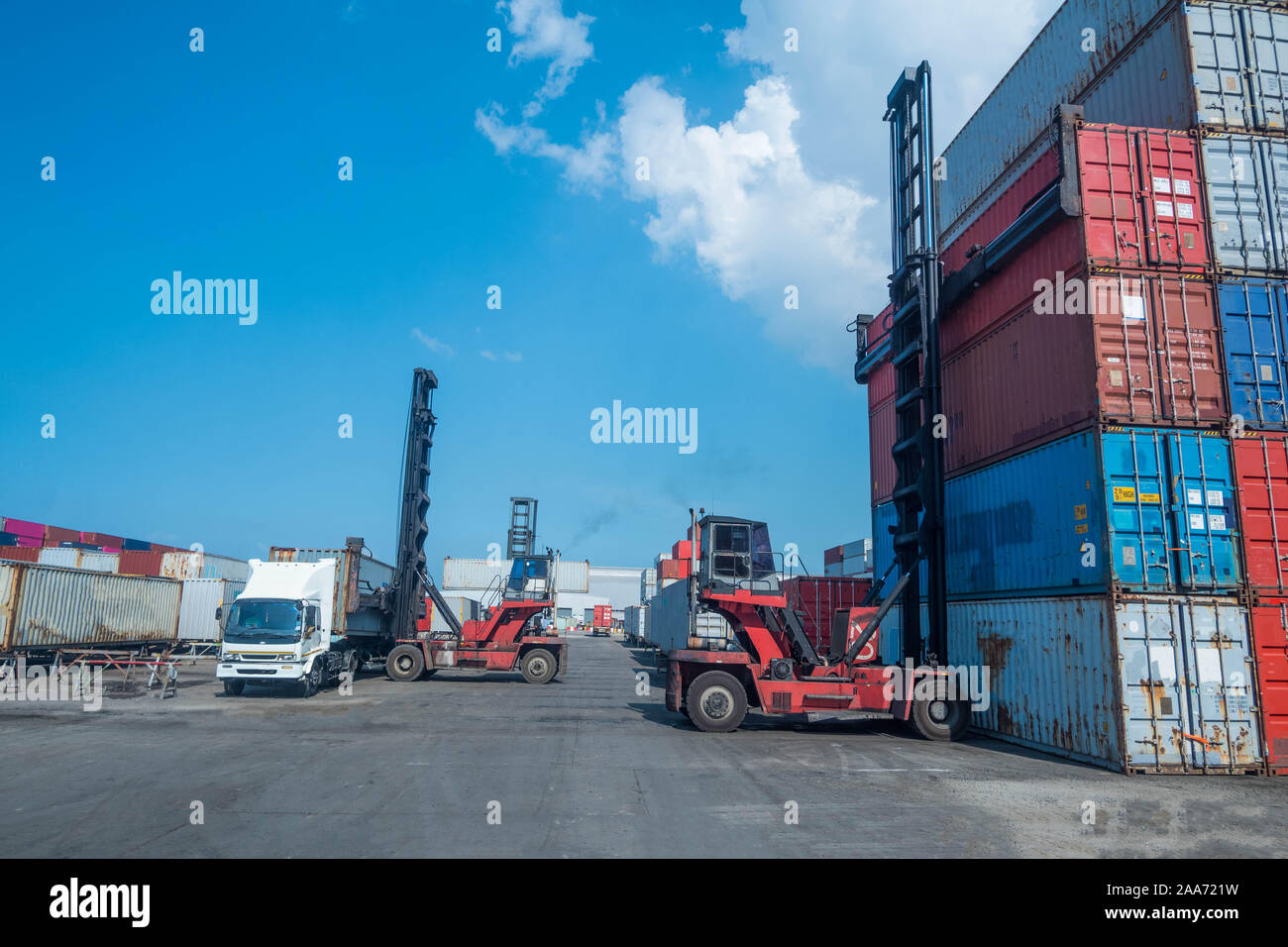 Container handlers In the shipping dock with storage cabinet background ...