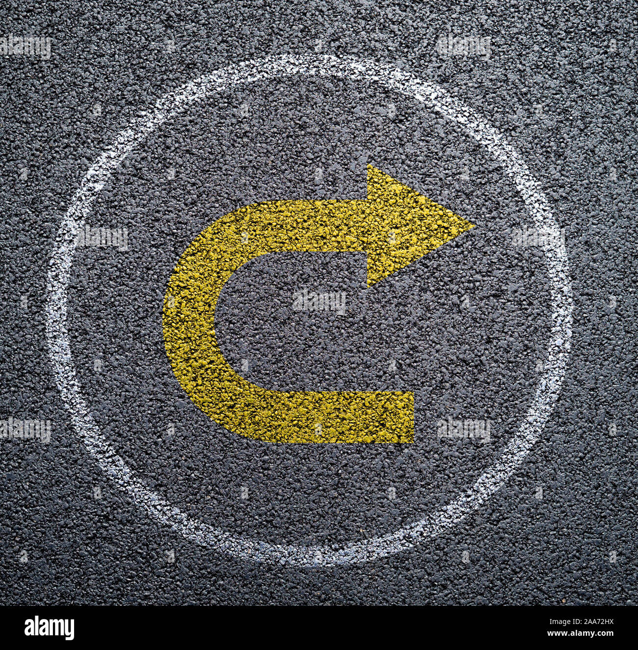 Yellow numbers and signs on the asphalt Stock Photo - Alamy