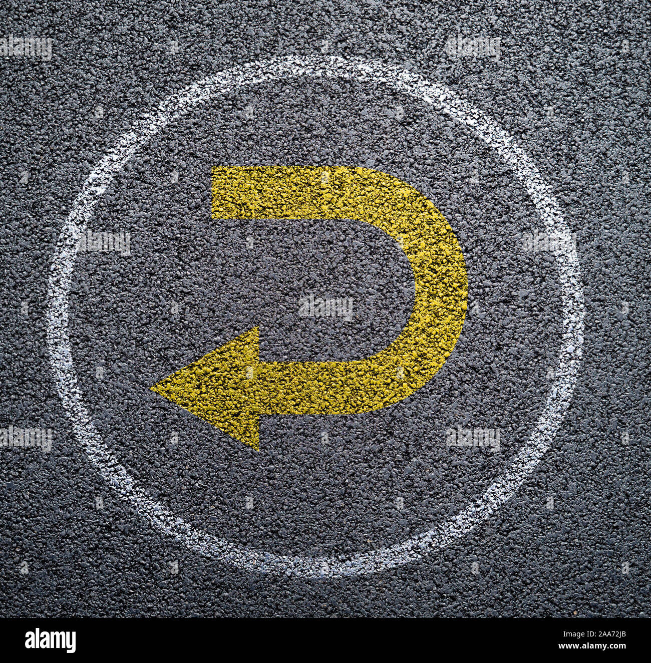 Yellow numbers and signs on the asphalt Stock Photo - Alamy