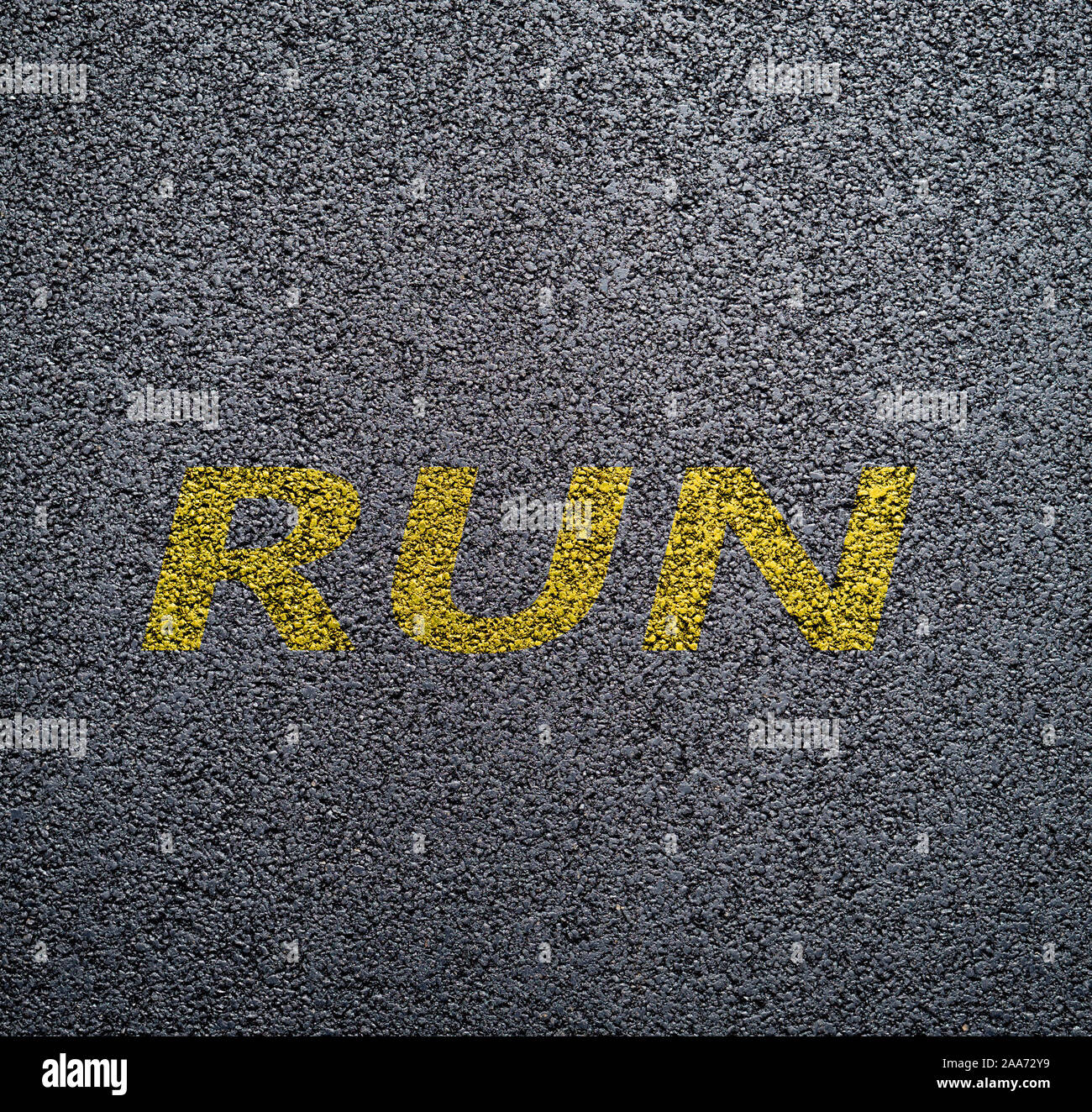 Yellow numbers and signs on the asphalt Stock Photo - Alamy