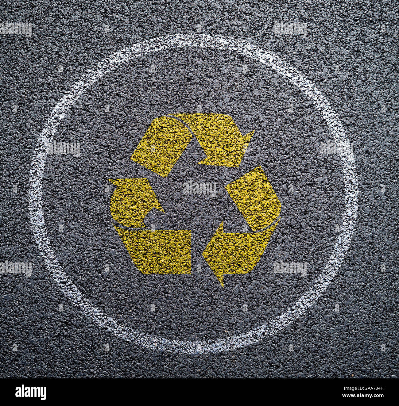 Yellow numbers and signs on the asphalt Stock Photo - Alamy