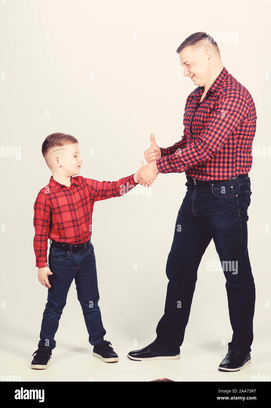 Father example of noble human. Cool guys. Father little son red shirts ...