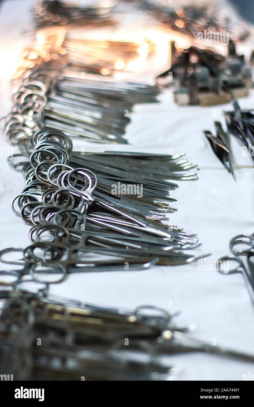 selective focus surgical instrument lying on table while group of ...