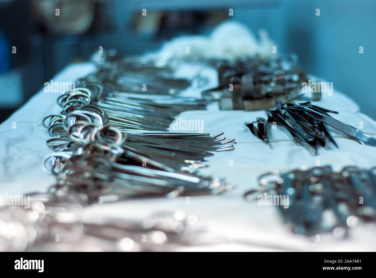 selective focus surgical instrument lying on table while group of ...