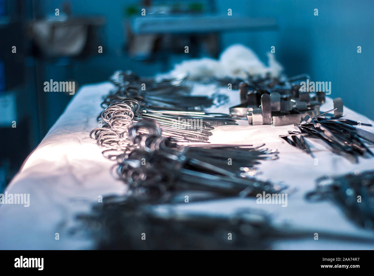selective focus surgical instrument lying on table while group of ...