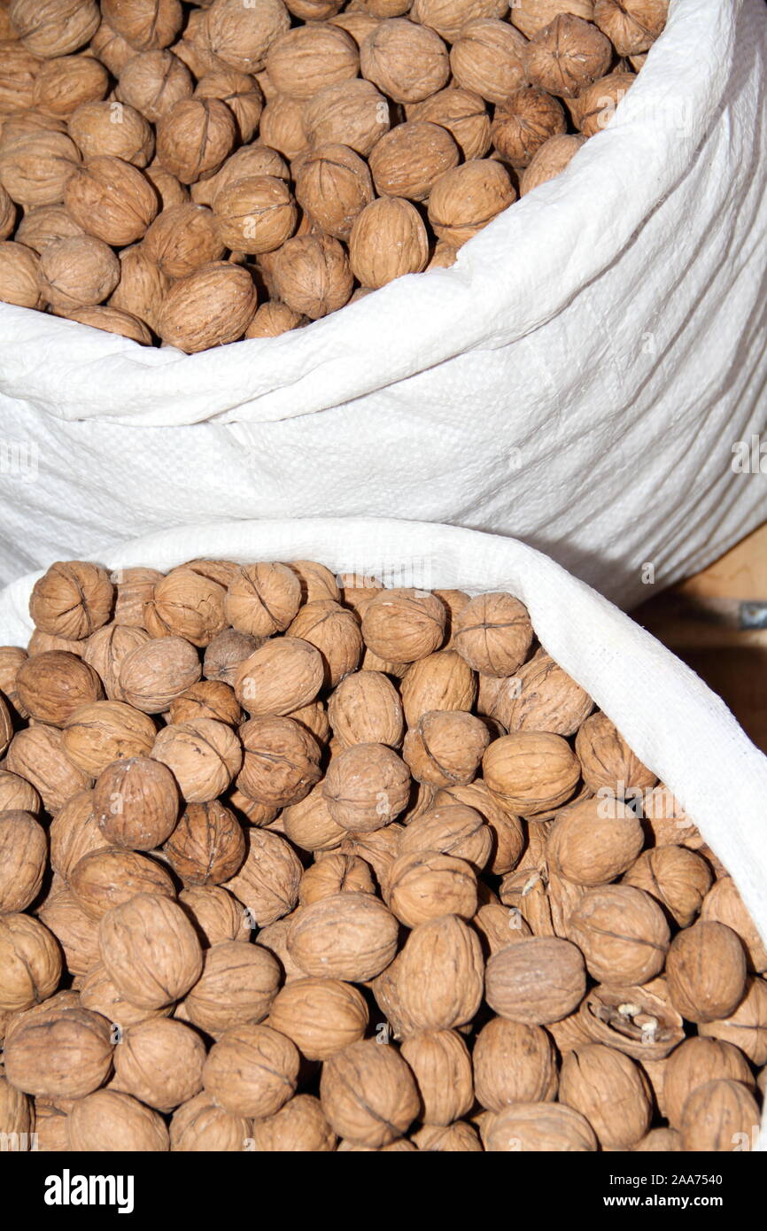 White sack full walnuts hi-res stock photography and images - Alamy