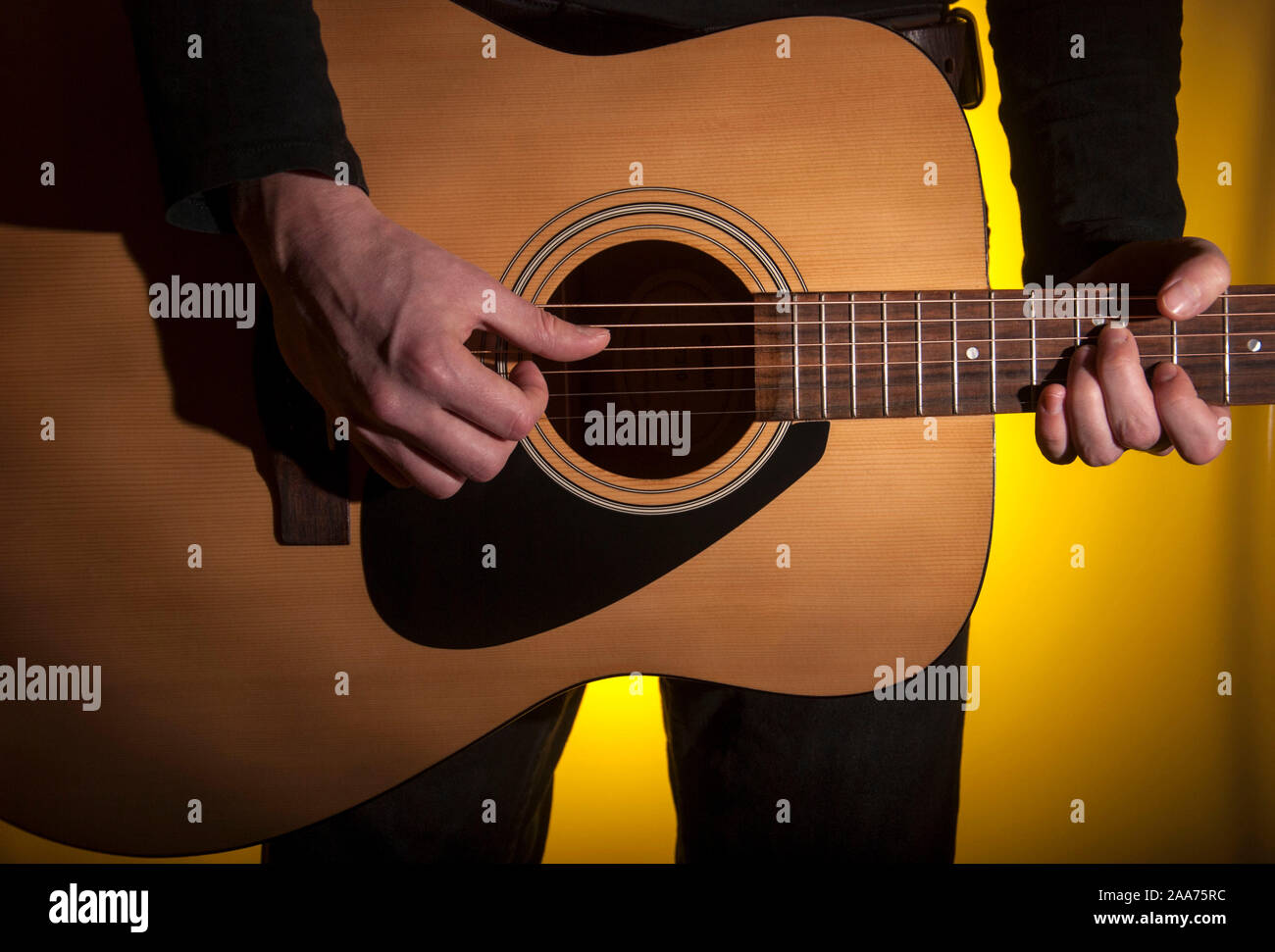 dramatic, musician, guitarist, light yellow background warm strings ...