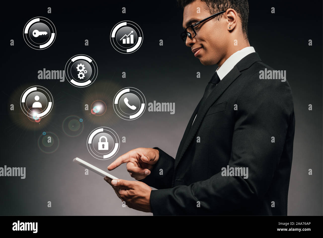 side view of smiling african american businessman using digital tablet ...