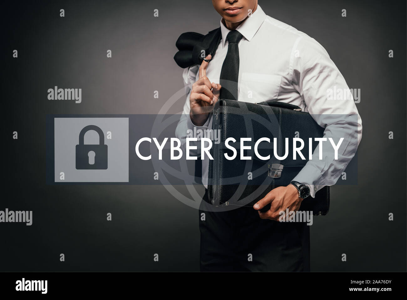 cropped view of african american businessman holding blazer and leather ...