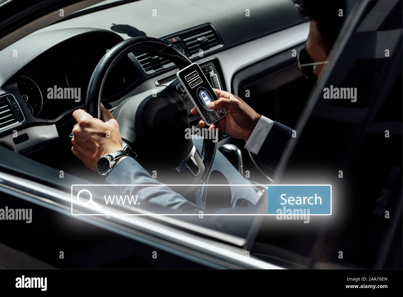 african american businessman in suit and sunglasses driving car and ...