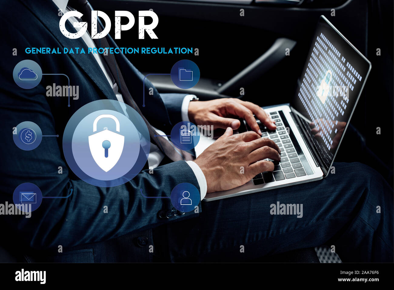 partial view of african american businessman using laptop with gdpr ...