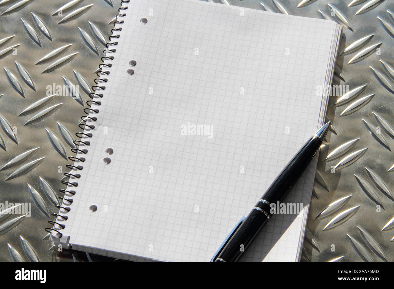 empty writing pad with pen on a table Stock Photo - Alamy