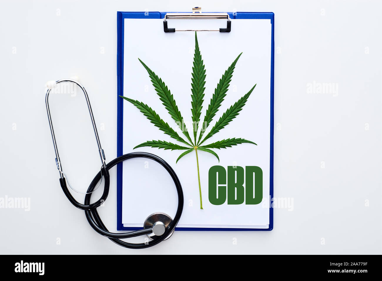 top view of medical cannabis leaf on clipboard with cbd lettering near ...