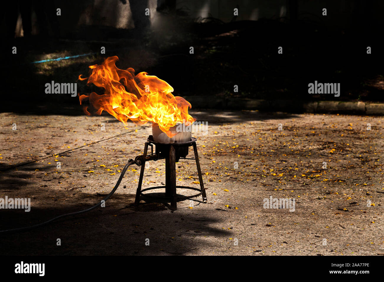 Flames caused by the explosion of the oil. Demonstration of water on ...