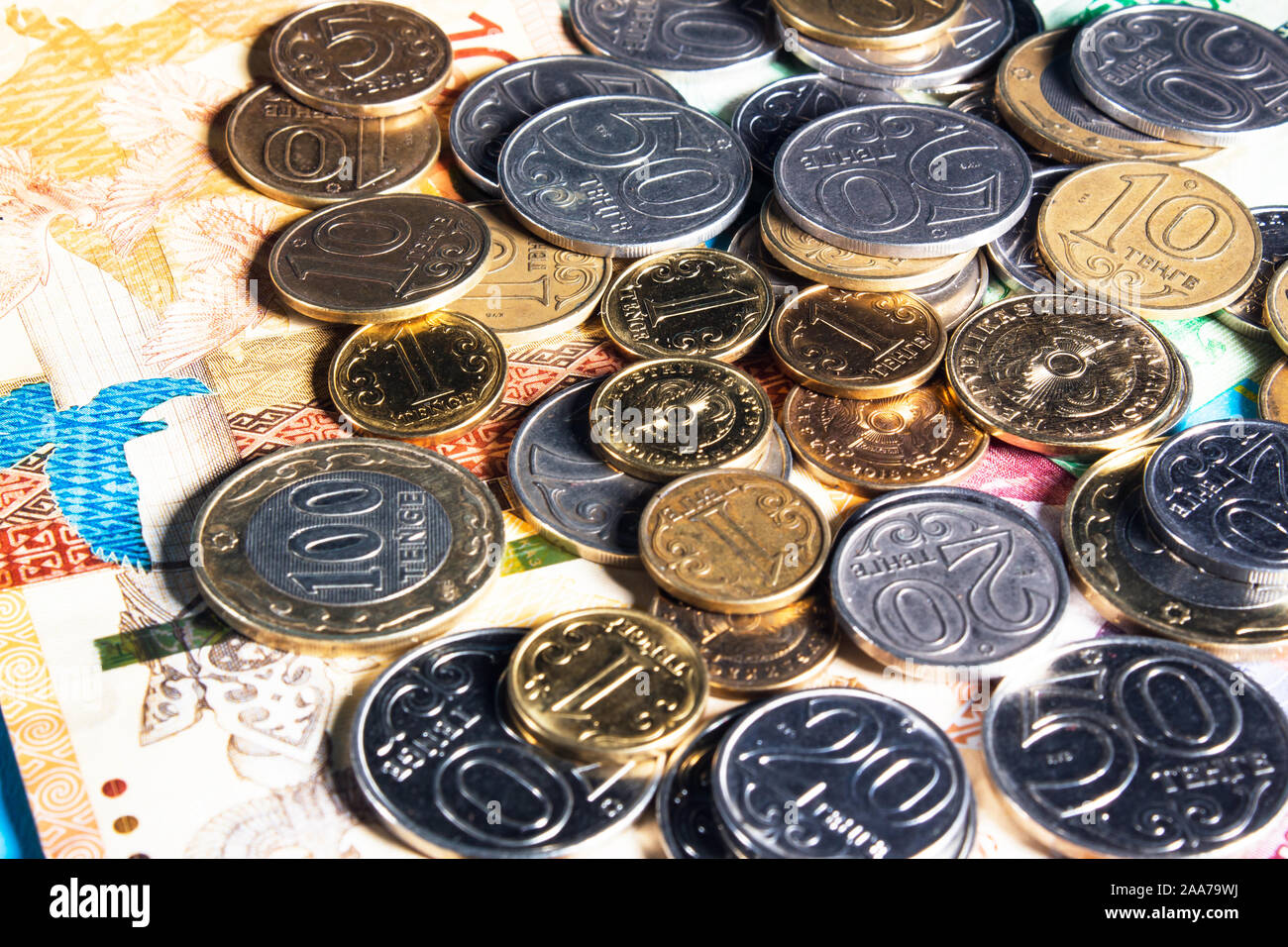 Tenge on a blue background with coins. Tenge banknotes. Coins Of ...