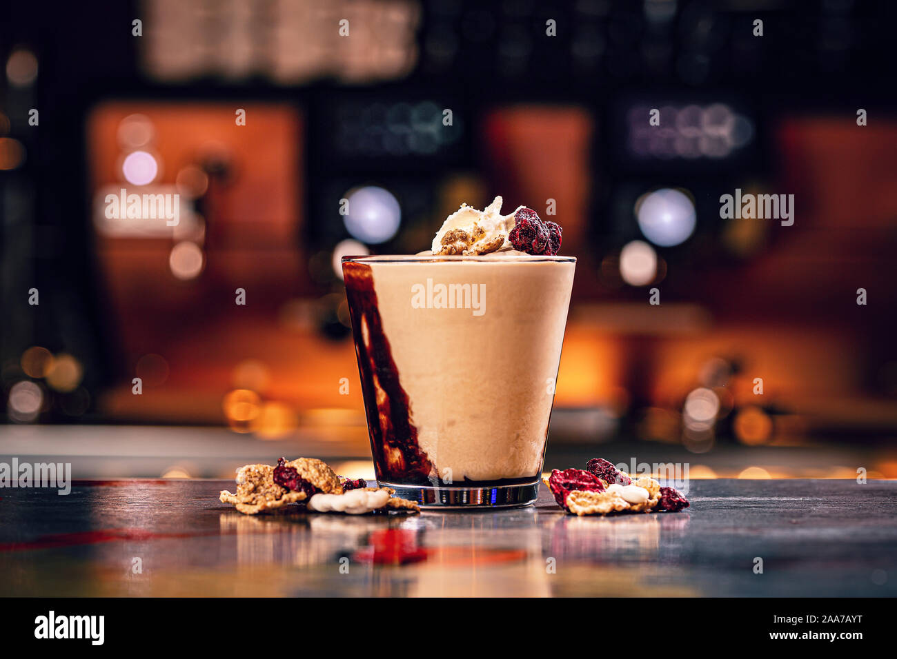 Freshly served iced latte coffee drink in a glass, on cafe diner ...