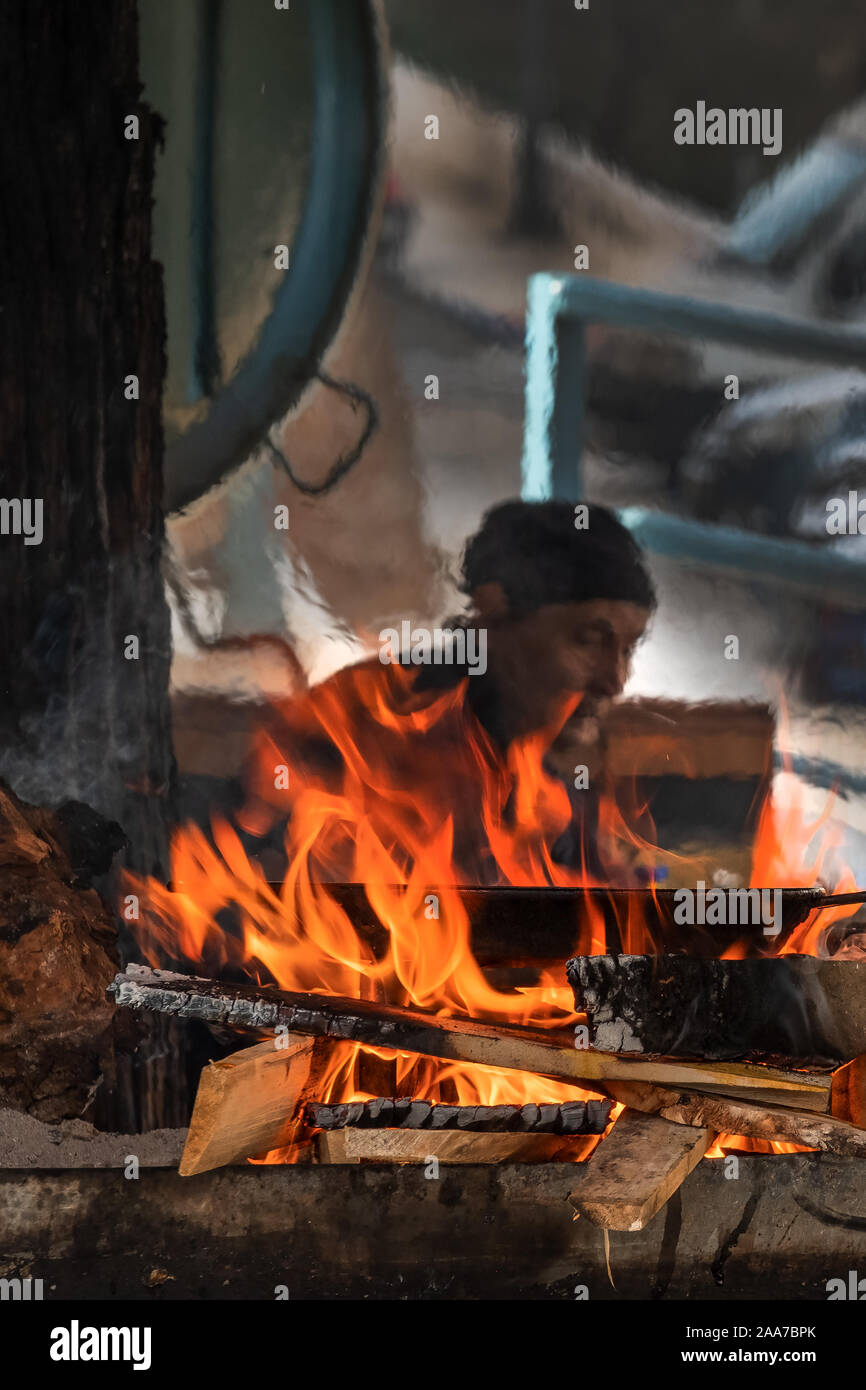 preparing traditional spanish food on an open fire Stock Photo - Alamy