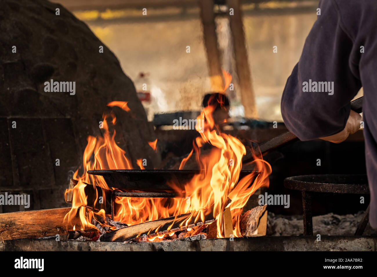 preparing traditional spanish food on an open fire Stock Photo - Alamy