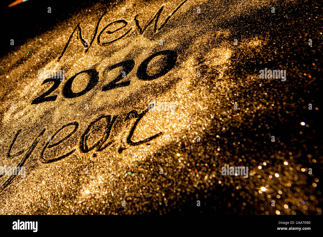 Happy New Year 2020. Beautiful sparkling Golden number 2020 on black ...
