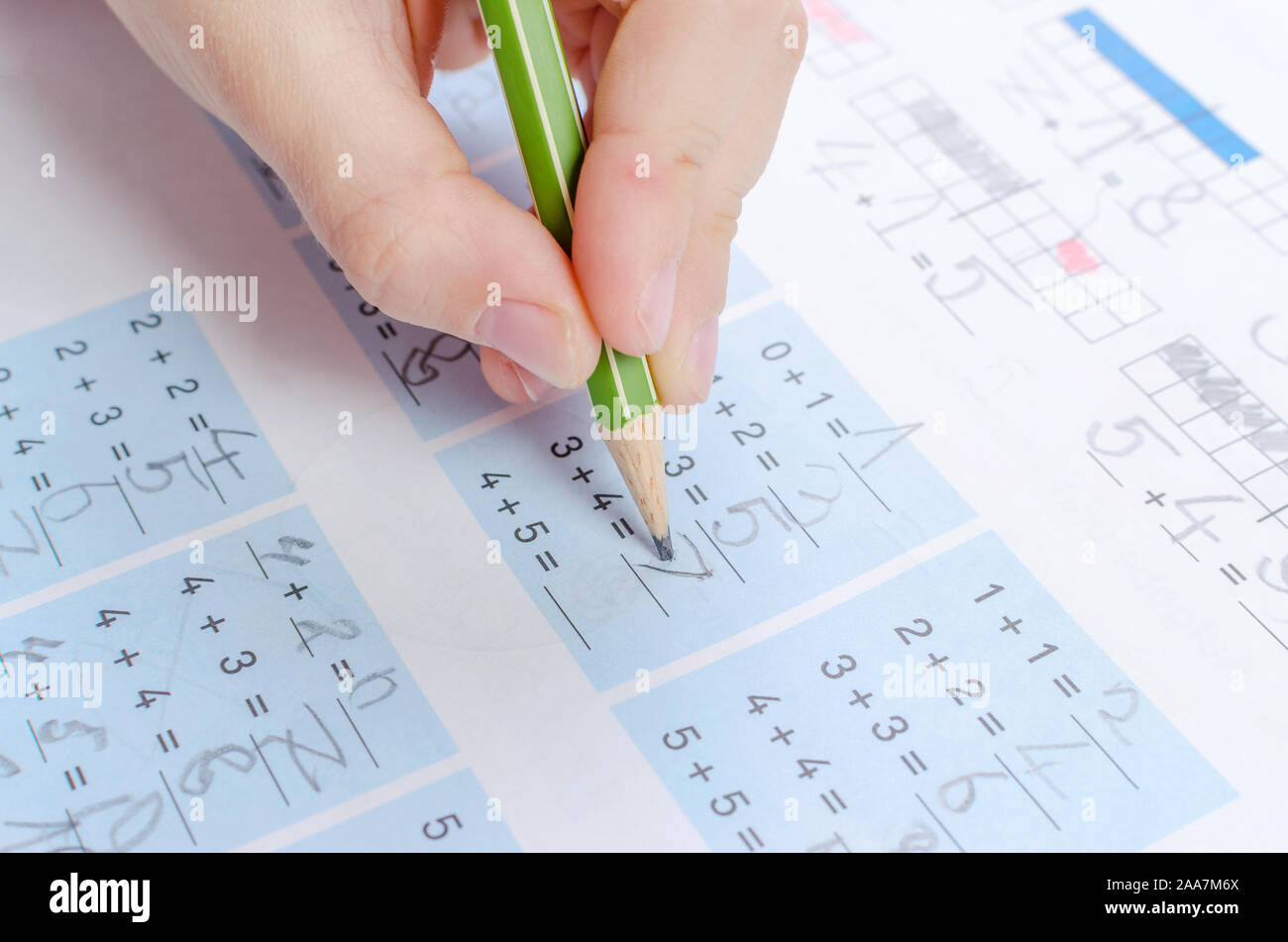 child is doing homework, math, close up Stock Photo - Alamy