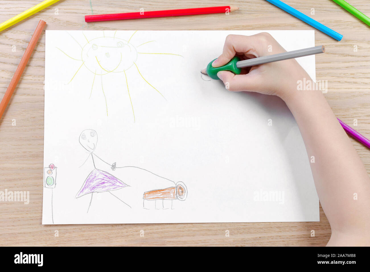 child's hand with writing tool for help by incorrect holding of pencil ...