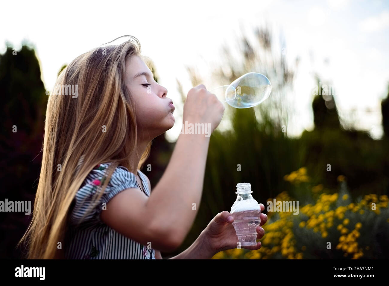 Happy little girl in autumn scenery Stock Photo - Alamy