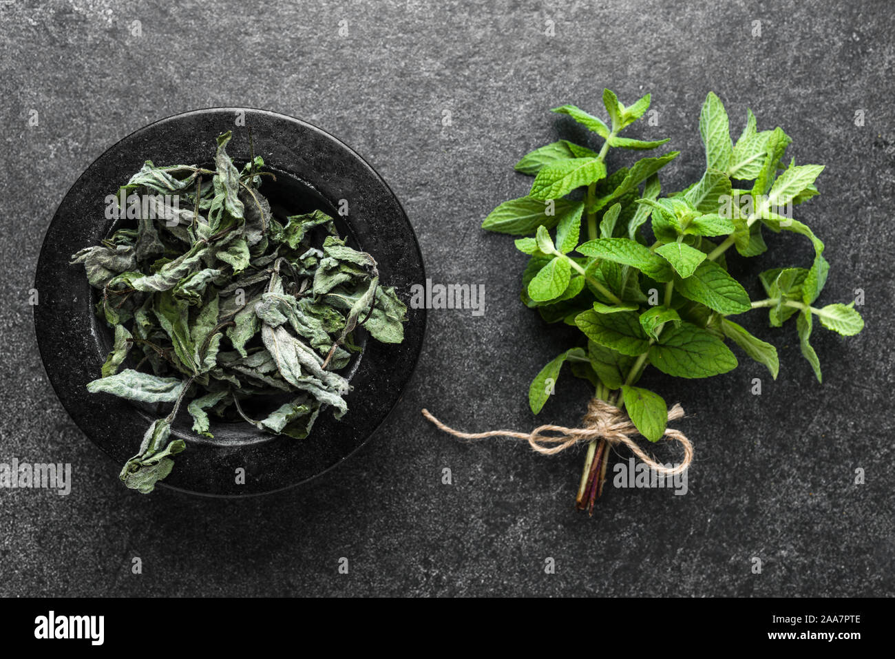 Dried herb of mint, fresh leaves and dry mint on dark background Stock ...