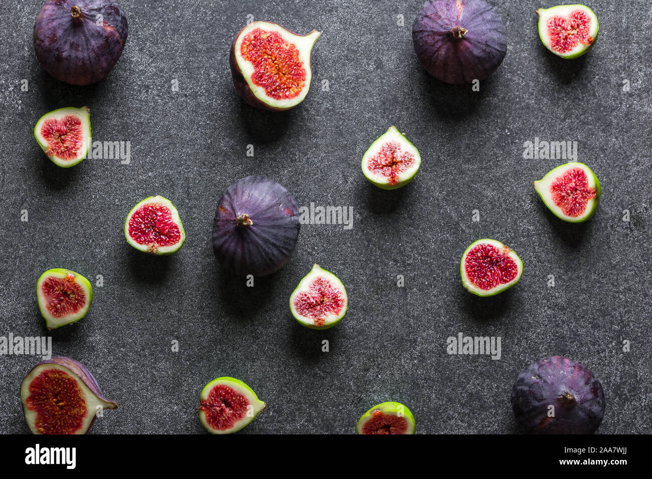 Fresh figs fruit. Purple fig slices, flat lay, top view Stock Photo - Alamy