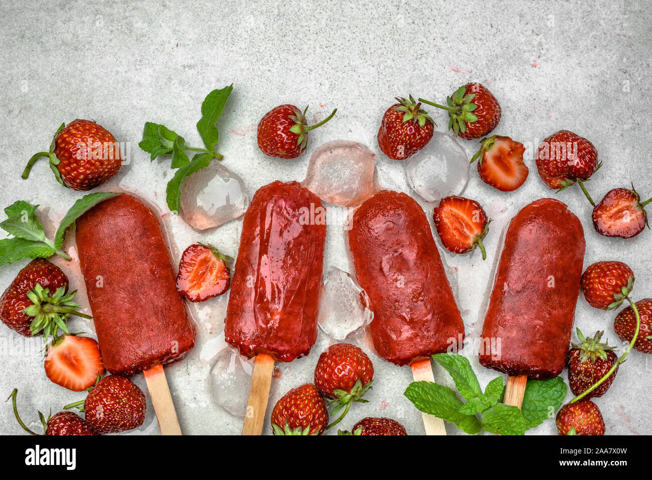Red popsicles with fruits. Strawberry popsicle, iced dessert, top view ...