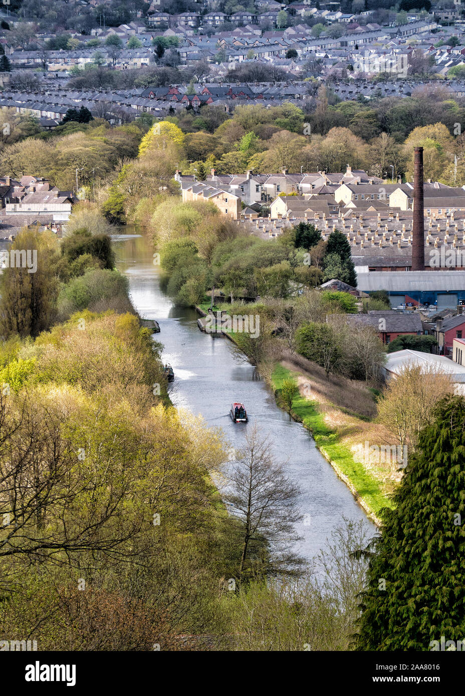 Narrowboat travelling along the Burnley Embankment on the Leeds and ...