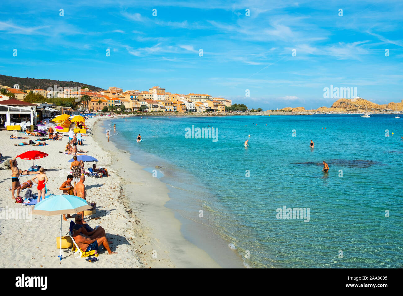 ILE-ROUSSE, FRANCE - SEPTEMBER 22, 2018: People sunbathing and bathing ...