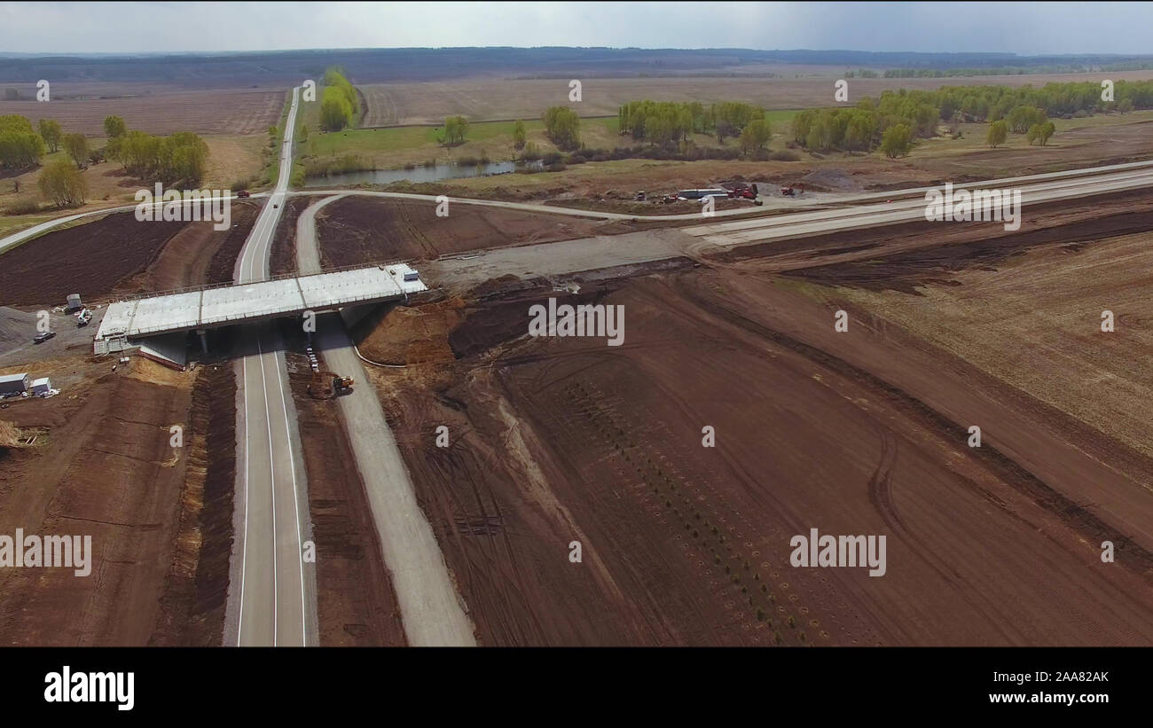 Aerial view construction of a new highway. A drone flies over a ...