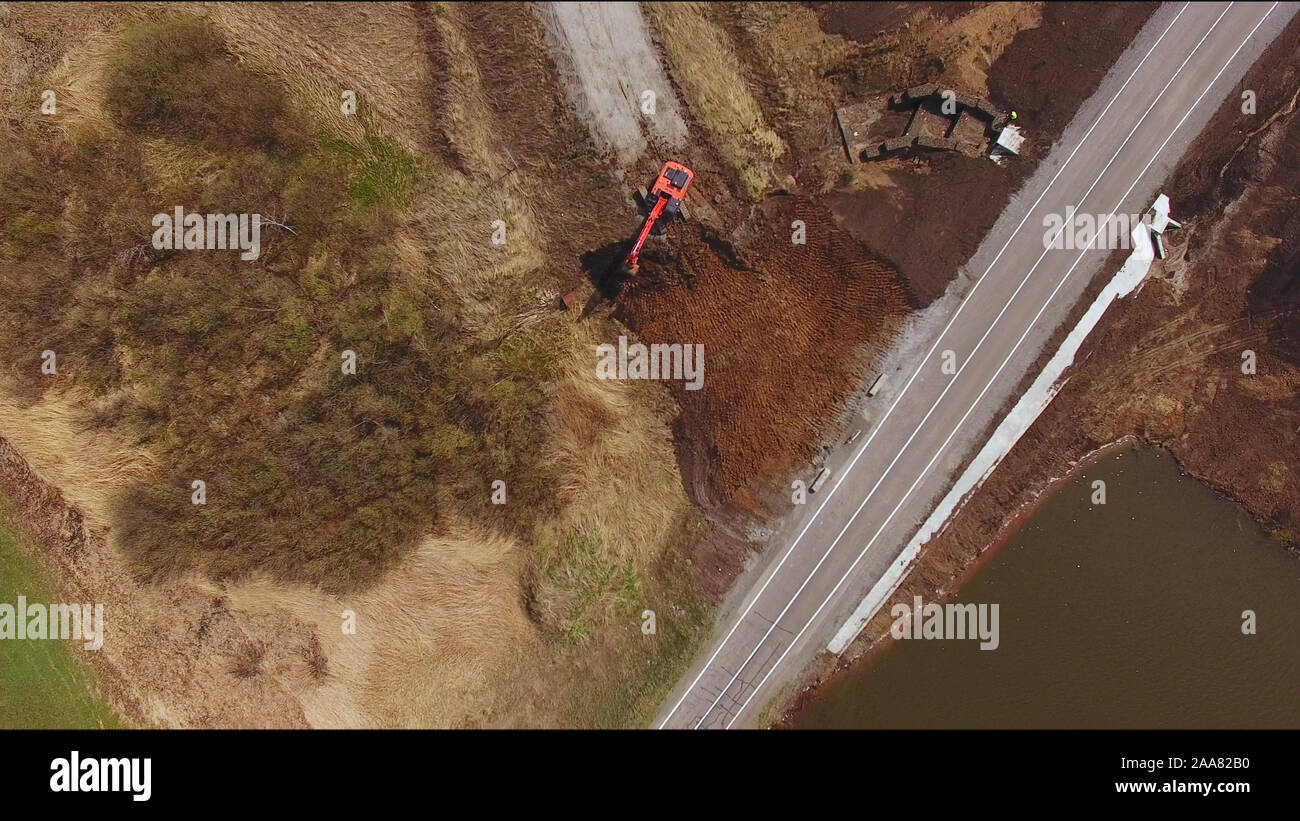 Aerial view construction of a new highway. Top view of an excavator ...