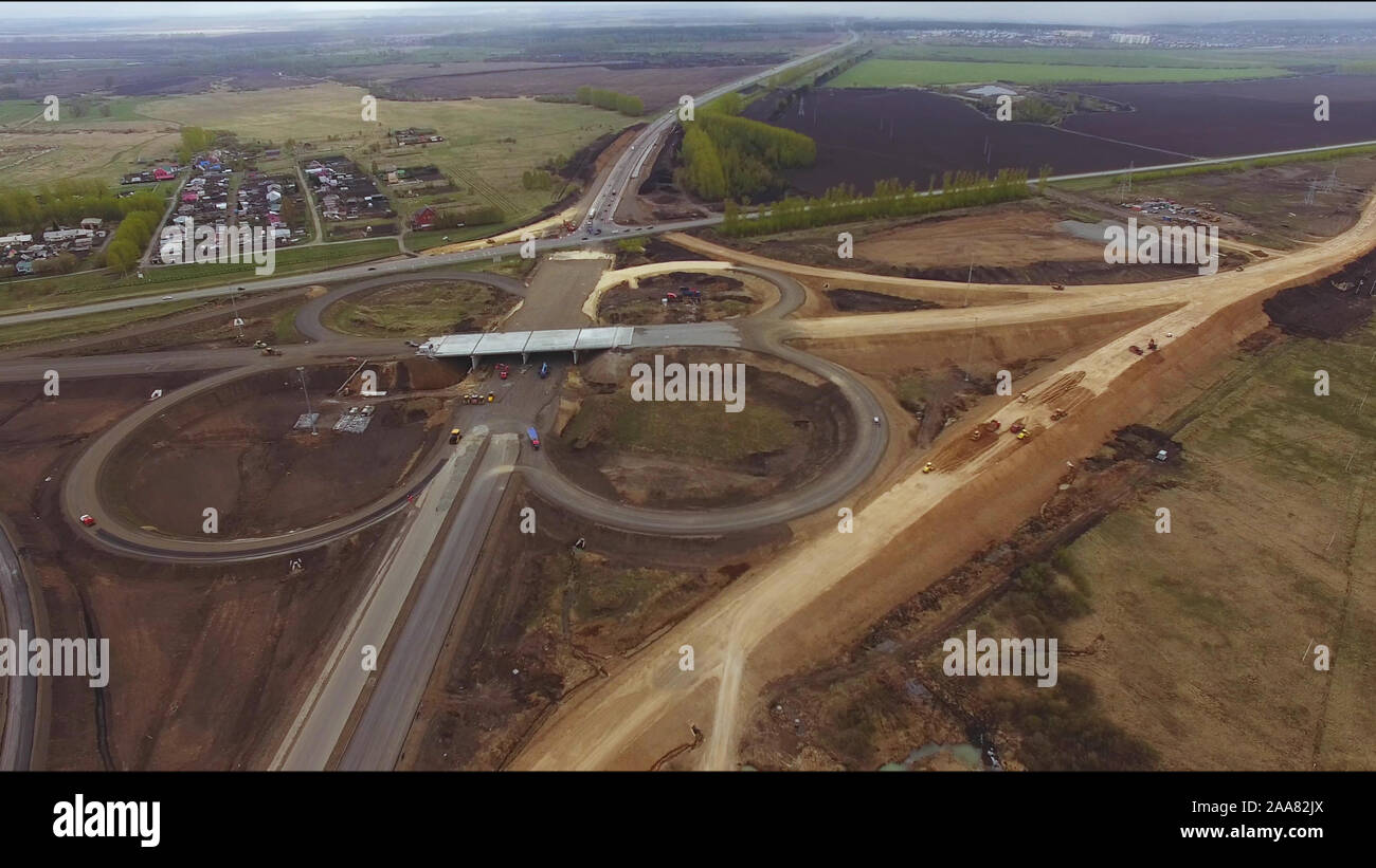 Aerial view construction of a new highway. A drone flies over a ...