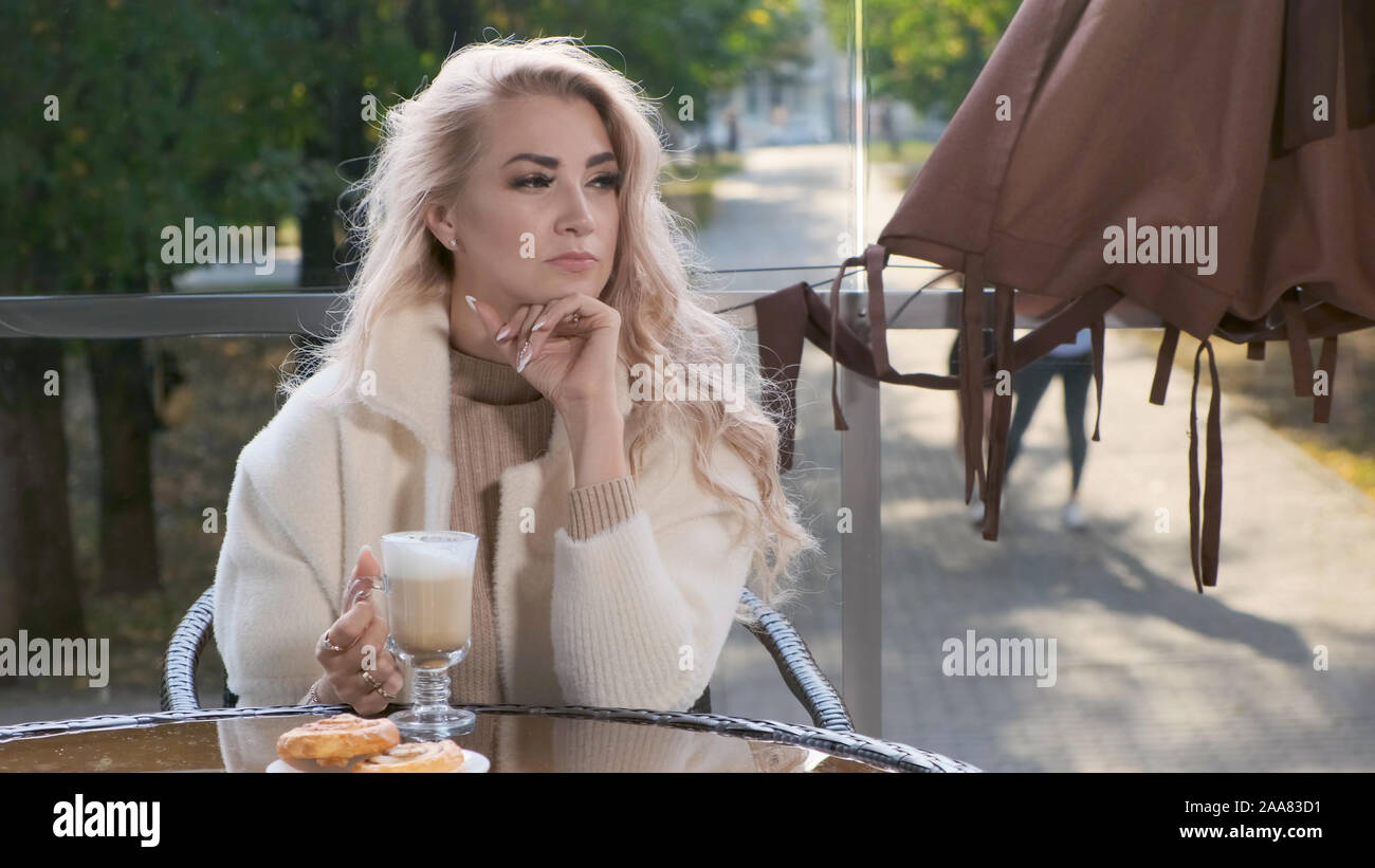 Woman coffee waiting in street hi-res stock photography and images - Alamy
