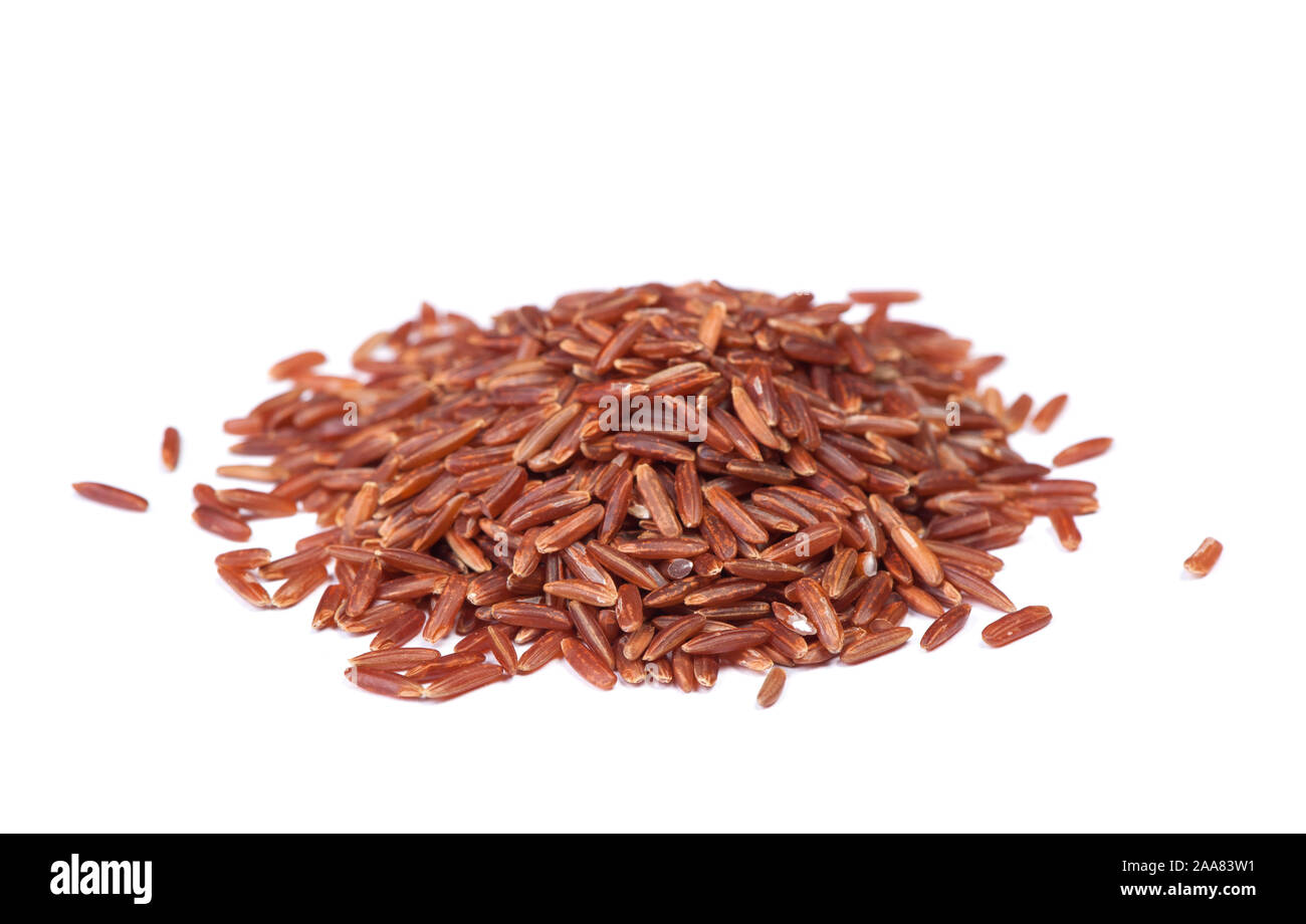 Heap of raw dry brown rice isolated on white background Stock Photo - Alamy