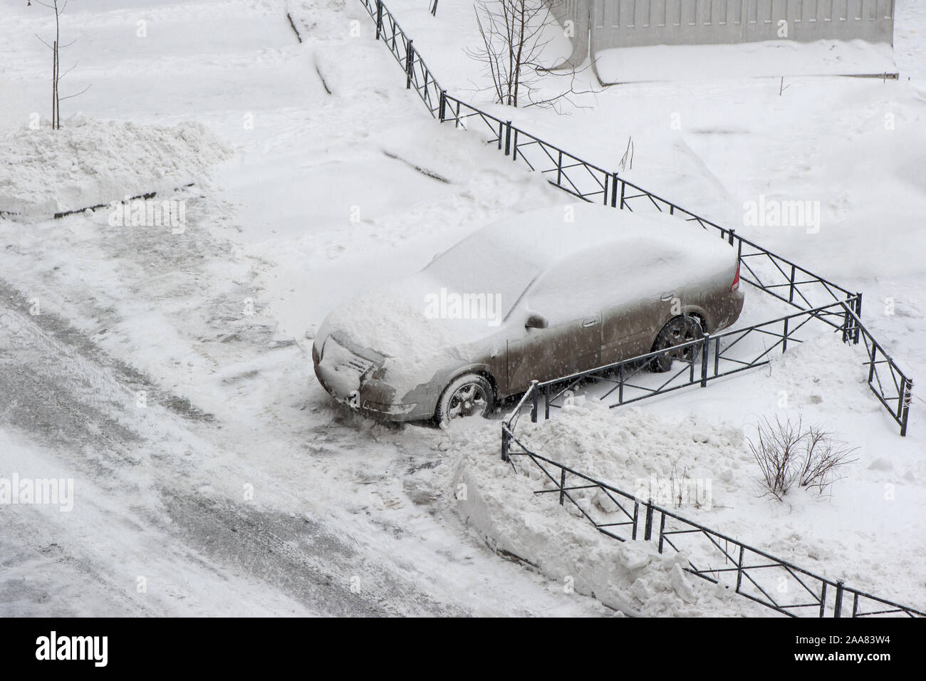Car under the snow at parking Stock Photo - Alamy