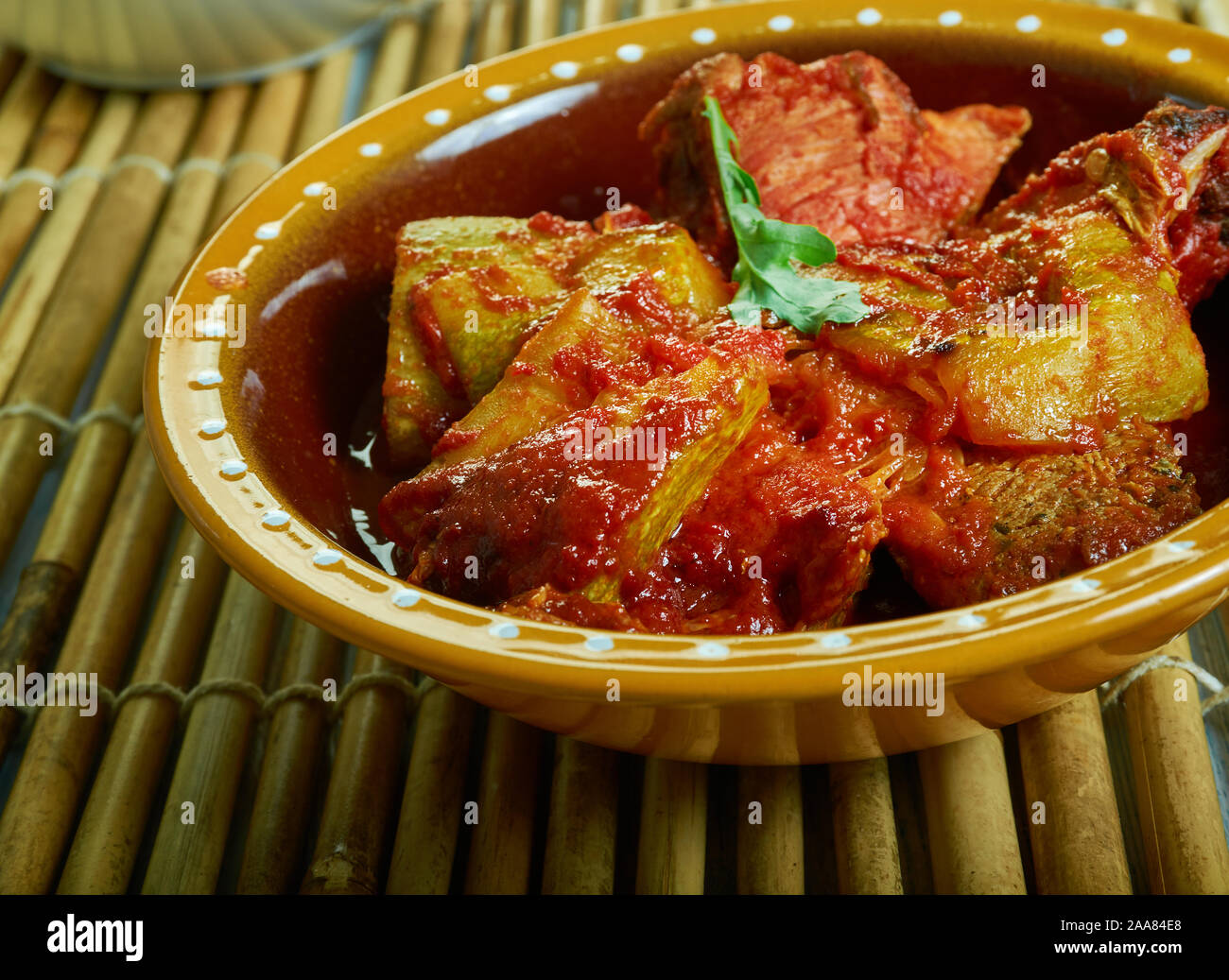 Carne de cerdo en pipian rojo, Pork in red sauce, Mexican cuisine Stock ...