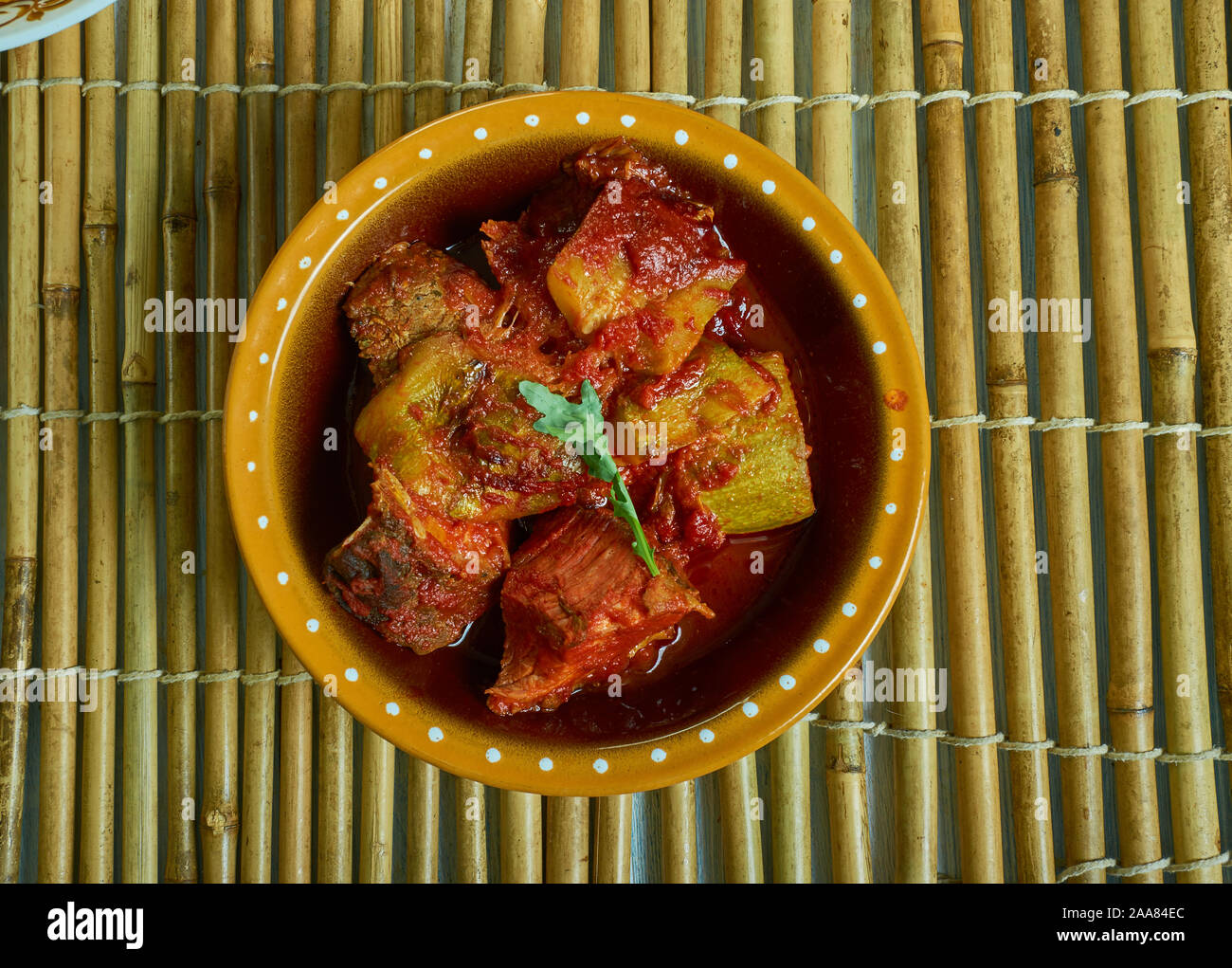 Carne de cerdo en pipian rojo, Pork in red sauce, Mexican cuisine Stock ...