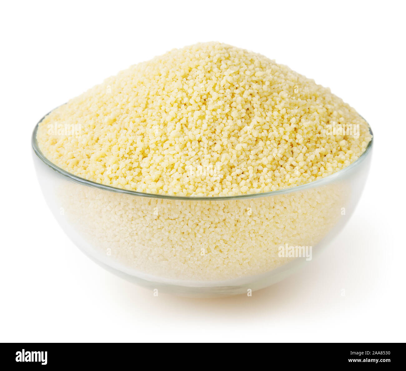 Dry couscous in glass bowl isolated on white background with clipping ...