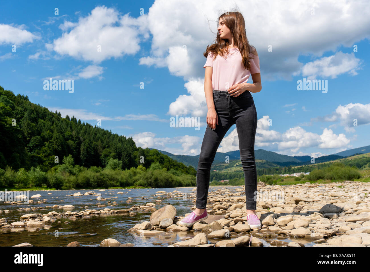 Model standing on rocks hi-res stock photography and images - Alamy