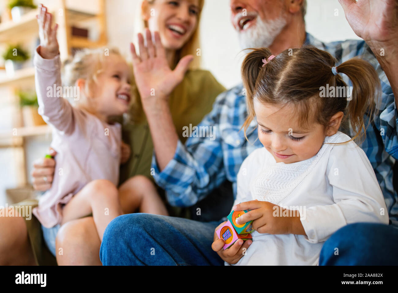 Happy family having fun time at home Stock Photo - Alamy