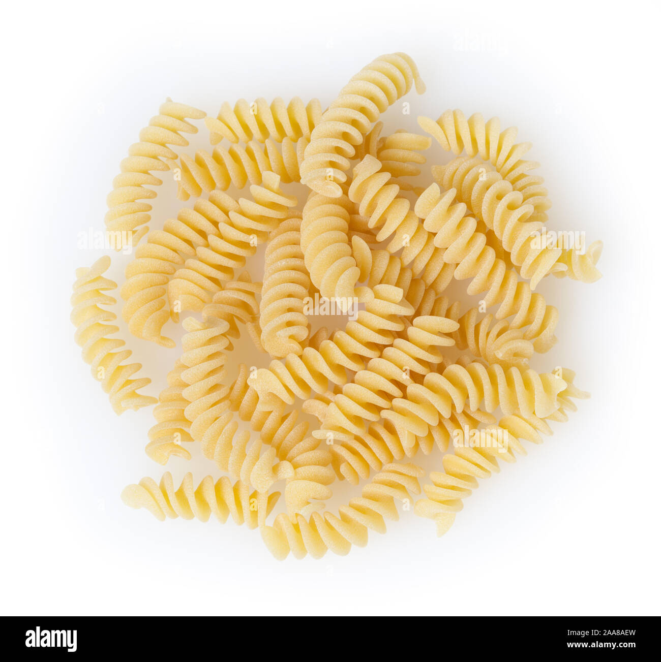 Uncooked fusilli pasta isolated on white background with clipping path ...