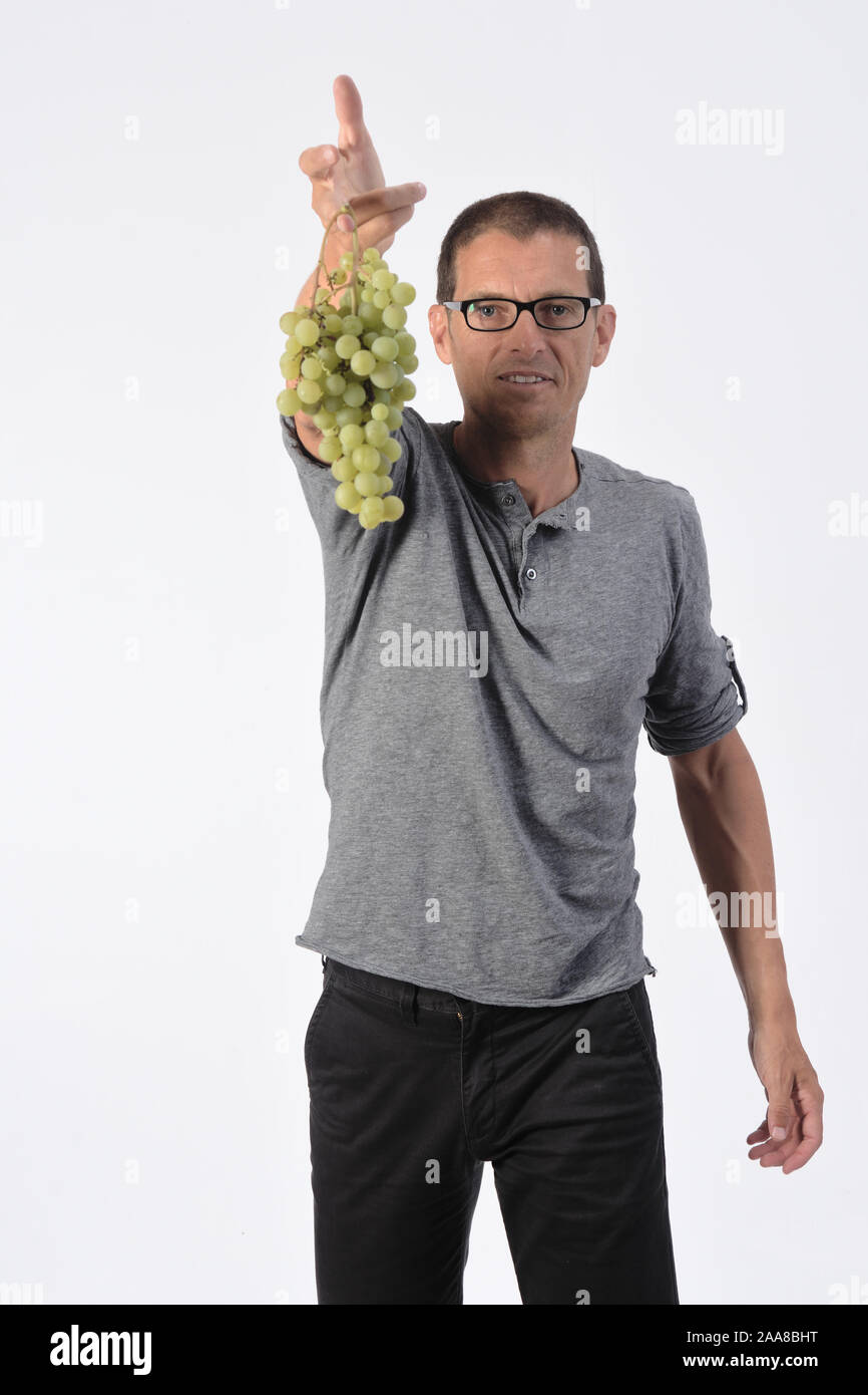 man with grape on white background Stock Photo - Alamy