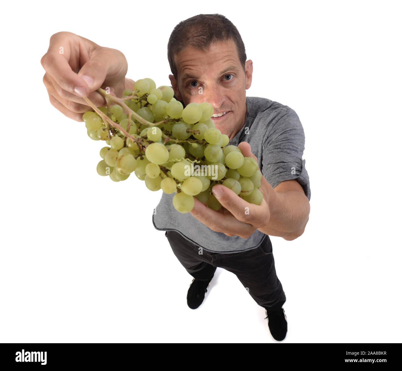 man with grape fruit on white background Stock Photo - Alamy