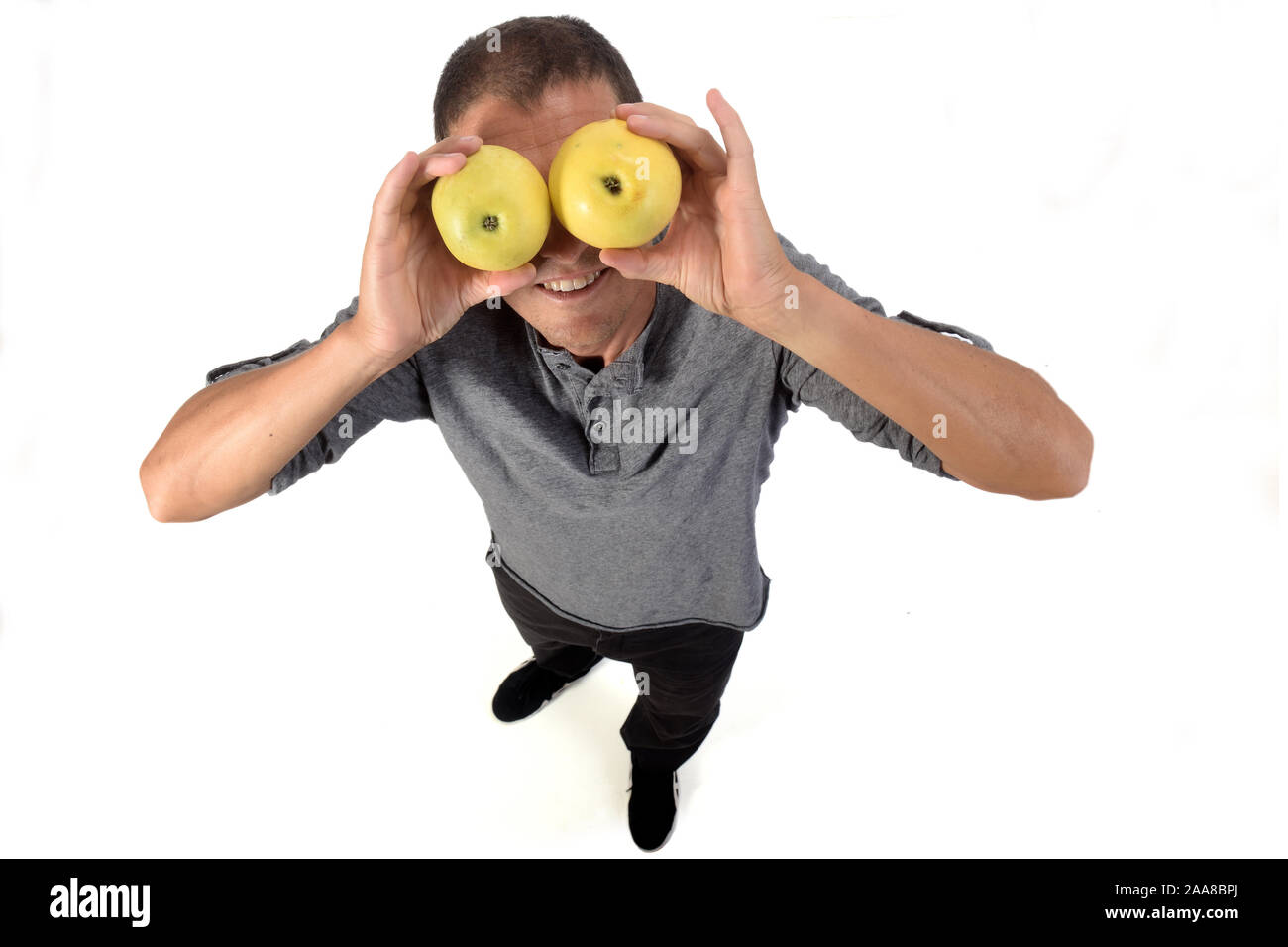 man with Apple on white background Stock Photo - Alamy