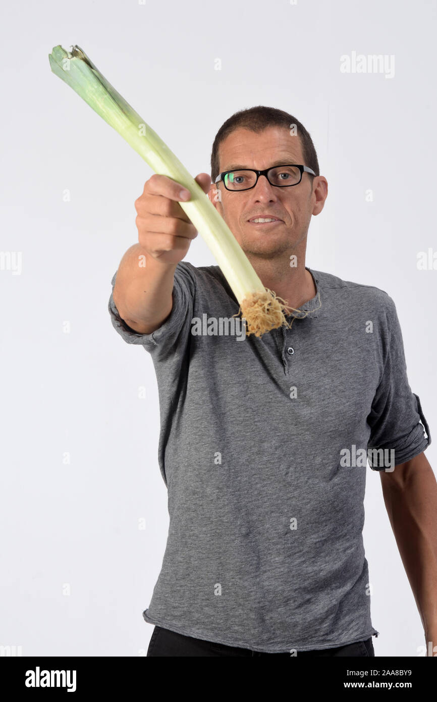 portrait of a man with leek on white background Stock Photo - Alamy