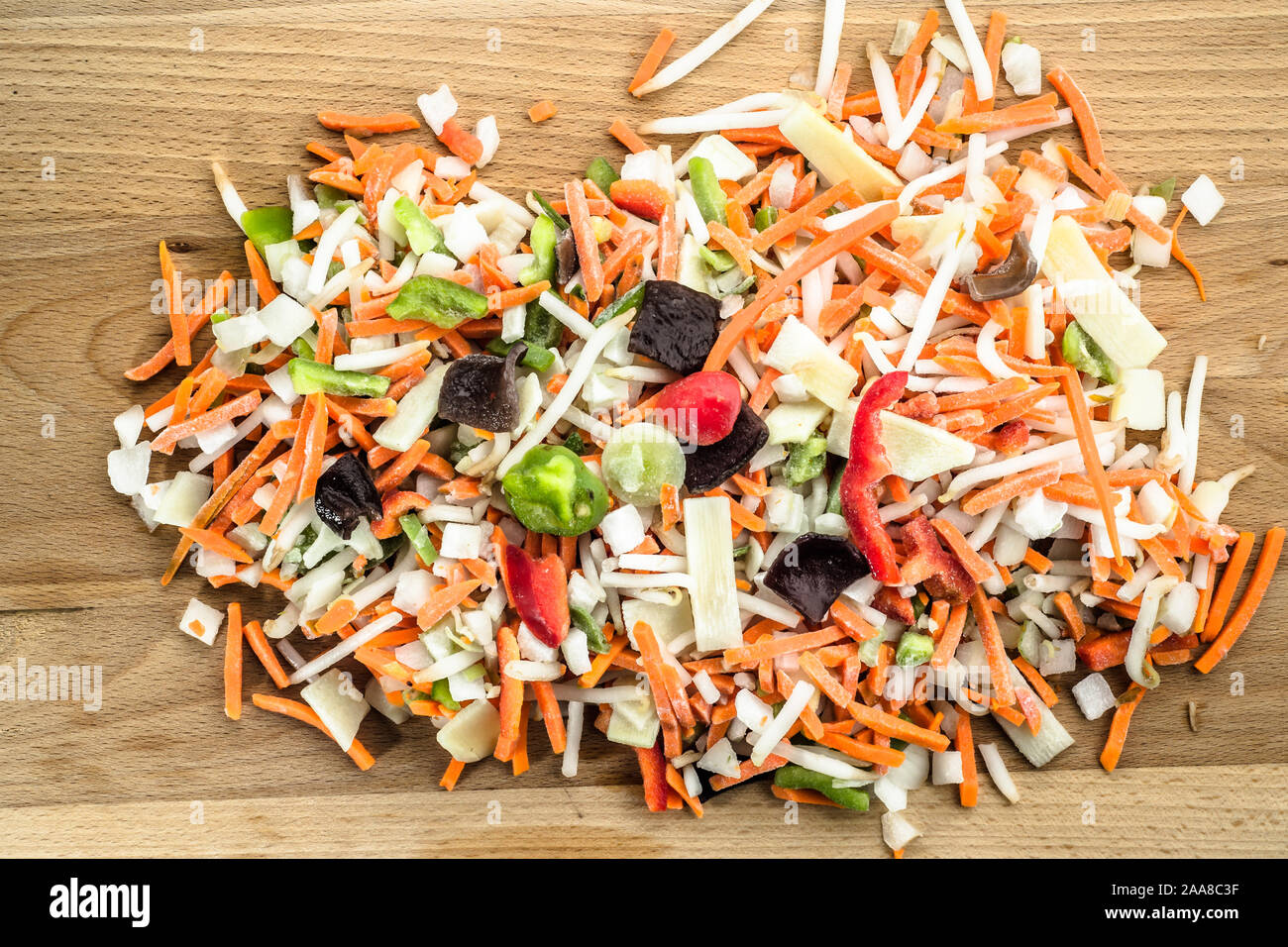 Chinese vegetables sliced in strips on wooden board Stock Photo - Alamy