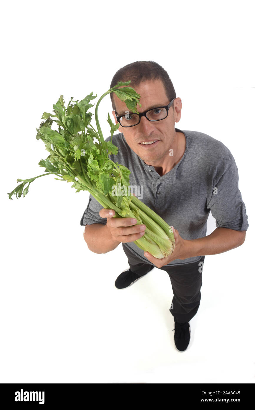 portrait of a man with celery on white background Stock Photo - Alamy