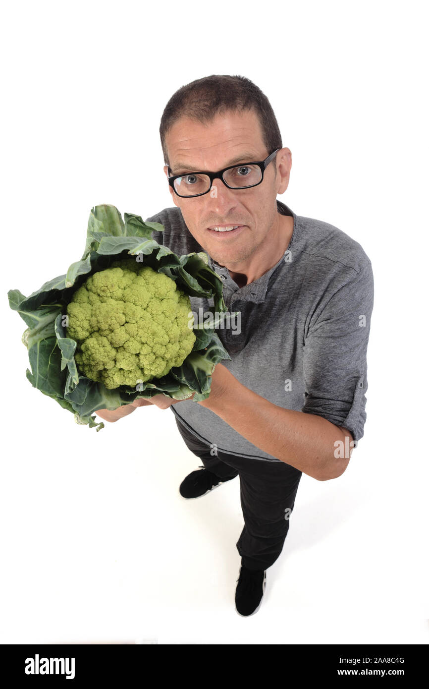 portrait of a man with broccoli on white background Stock Photo - Alamy